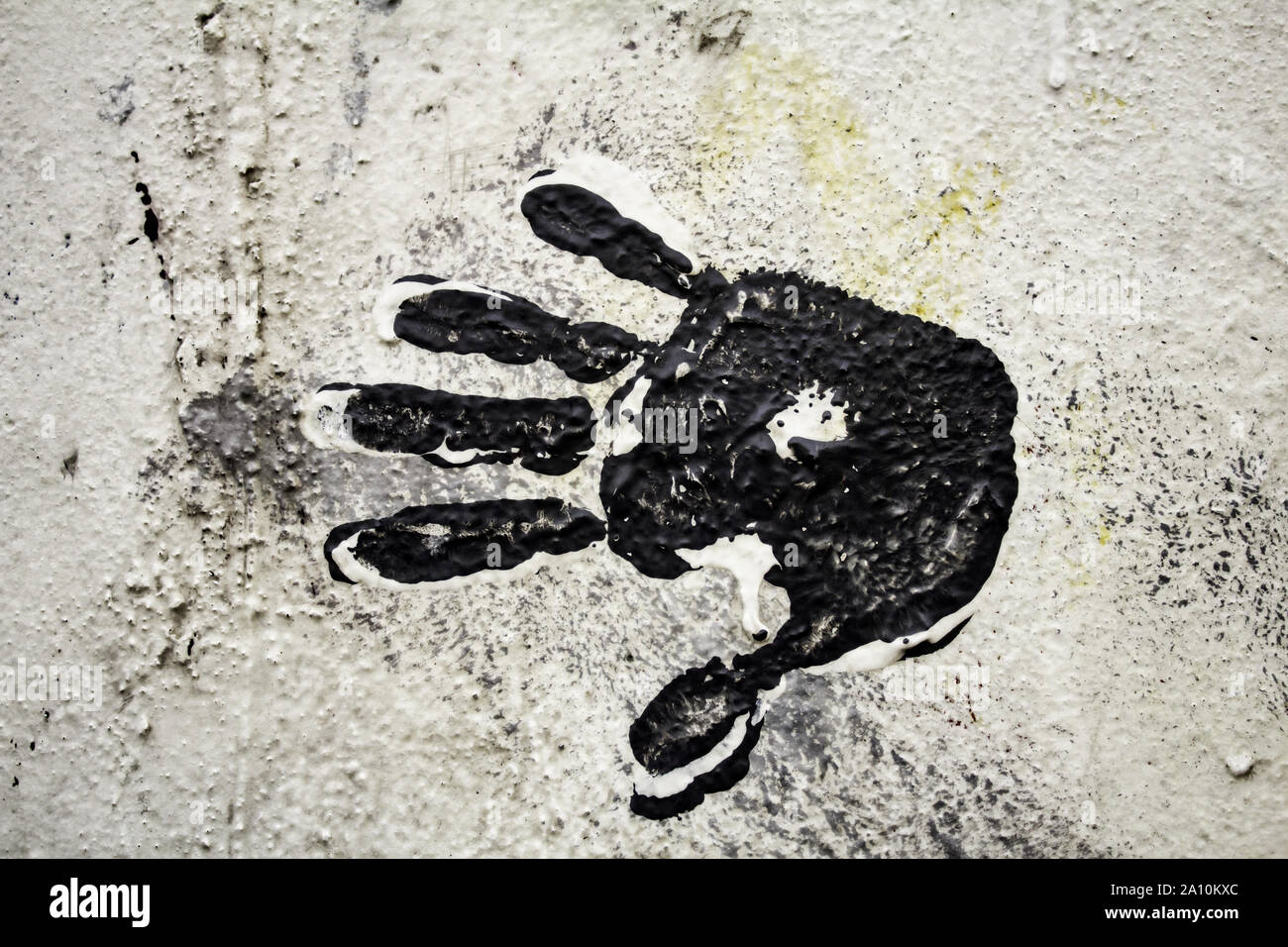 Footprints hand painted on wall, human symbol, peace Stock Photo - Alamy