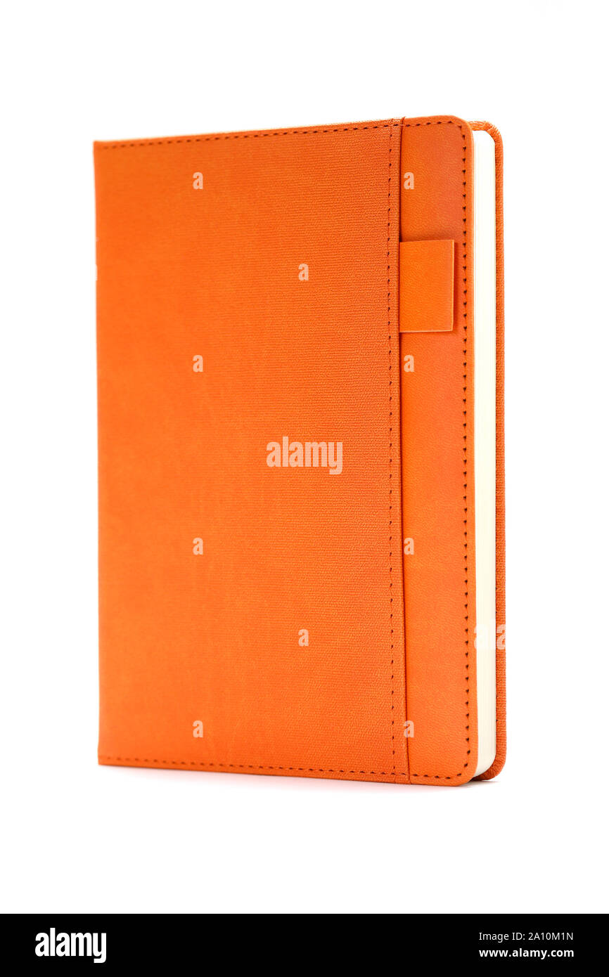 Orange diary isolated on white background Stock Photo - Alamy