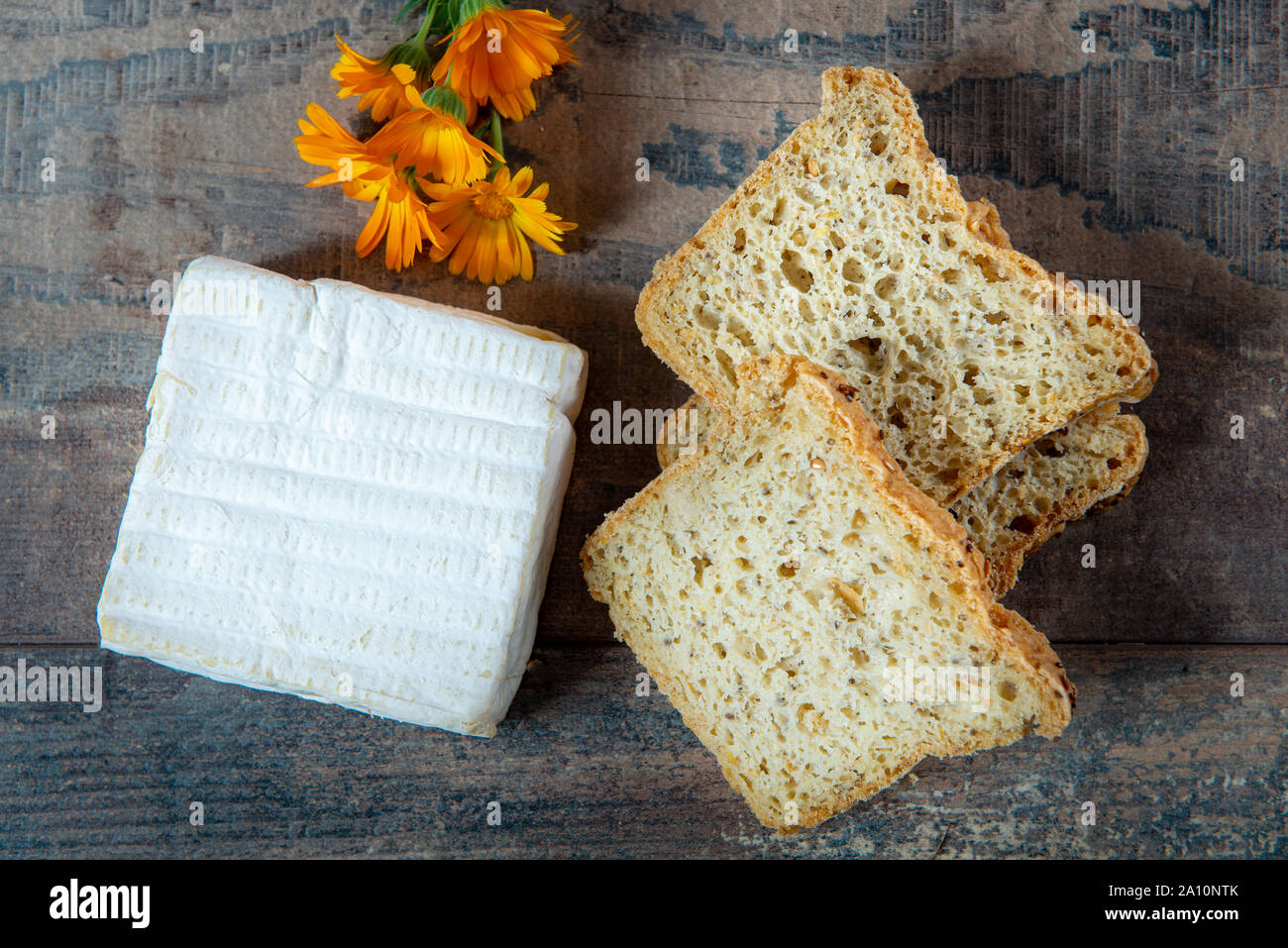 a Pont Eveque french normandy cheese with bread Stock Photo - Alamy