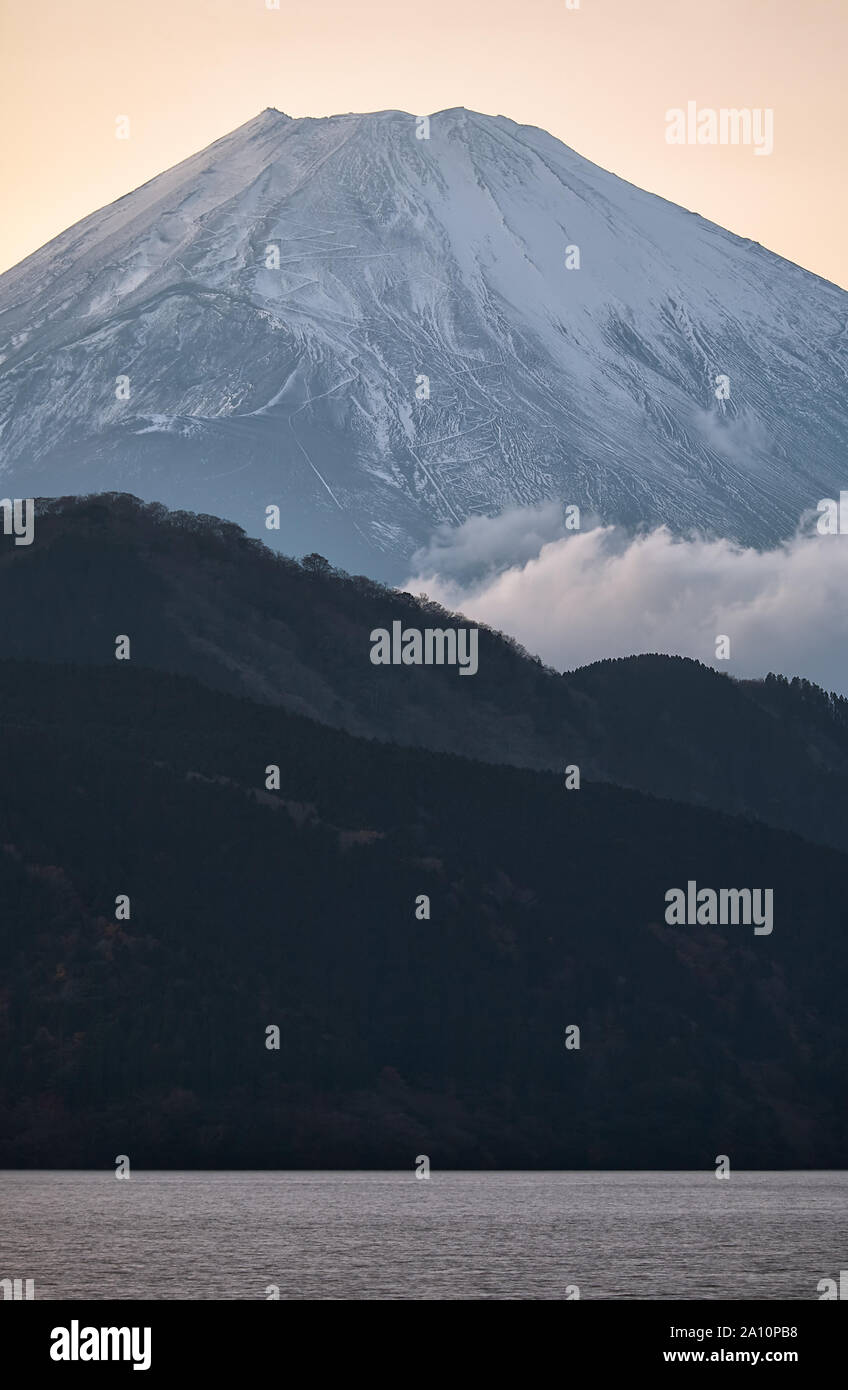 The zoom view of Mount Fuji summit in the clouds from the Hakone area ...