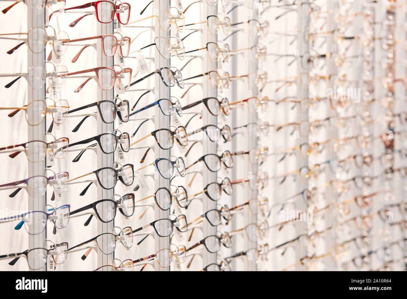 row of stylish glasses at an opticians. side view photo Stock Photo - Alamy