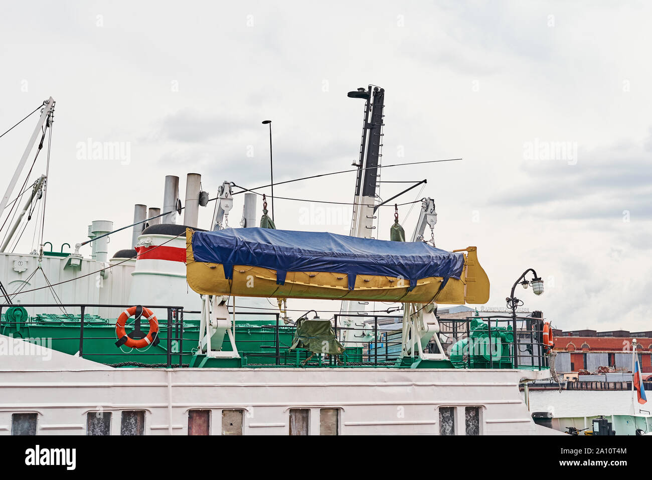 Close up lifeboat on cargo ship in port Stock Photo - Alamy