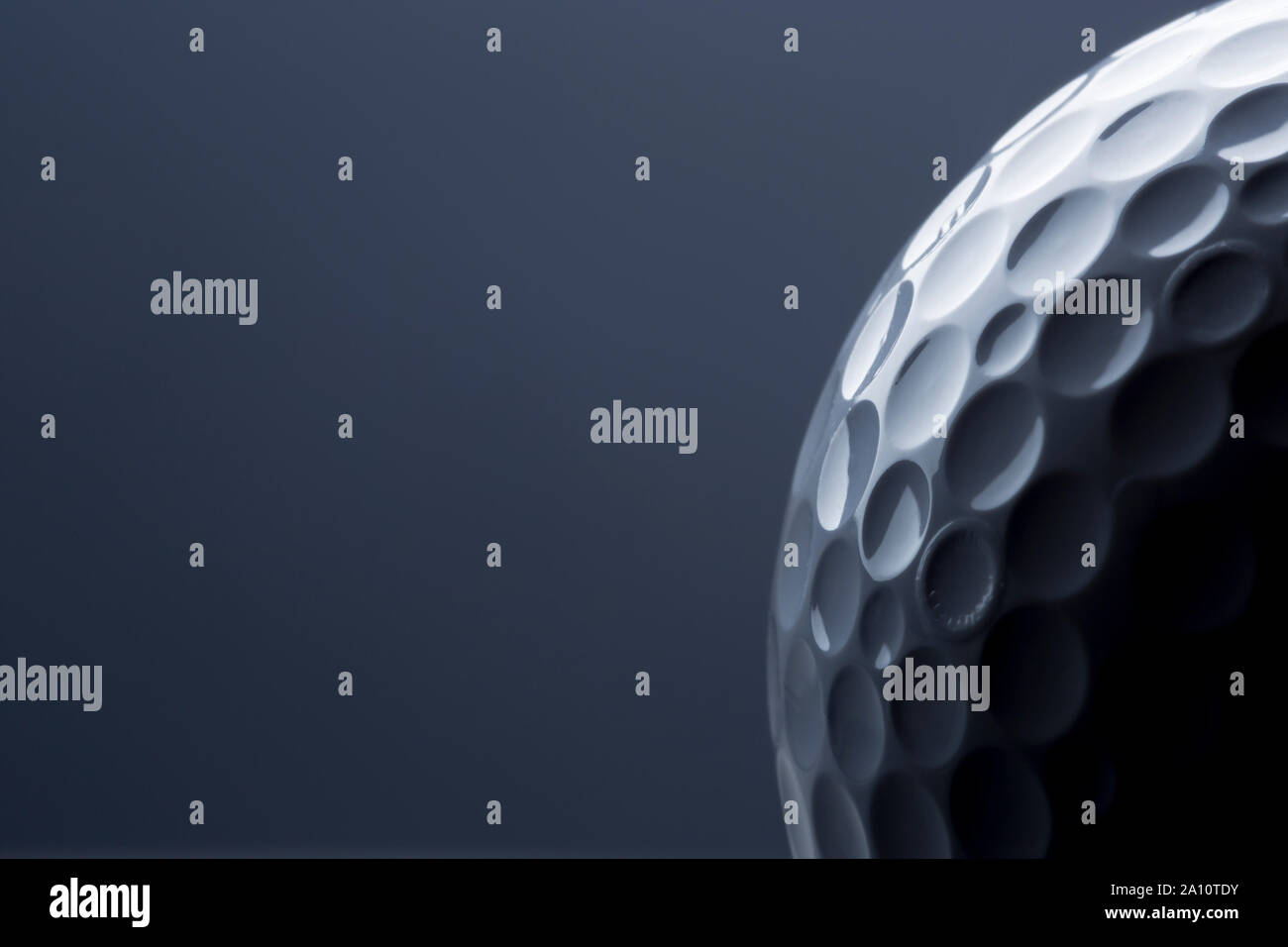 Stylish golf ball isolated on empty dark blue background Stock Photo ...