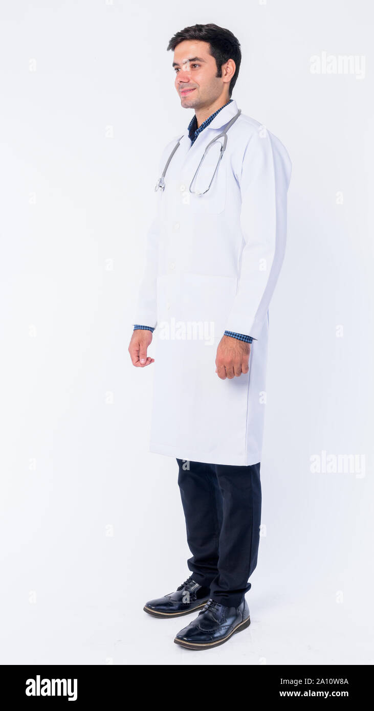 Full body shot of young Persian man doctor thinking Stock Photo - Alamy