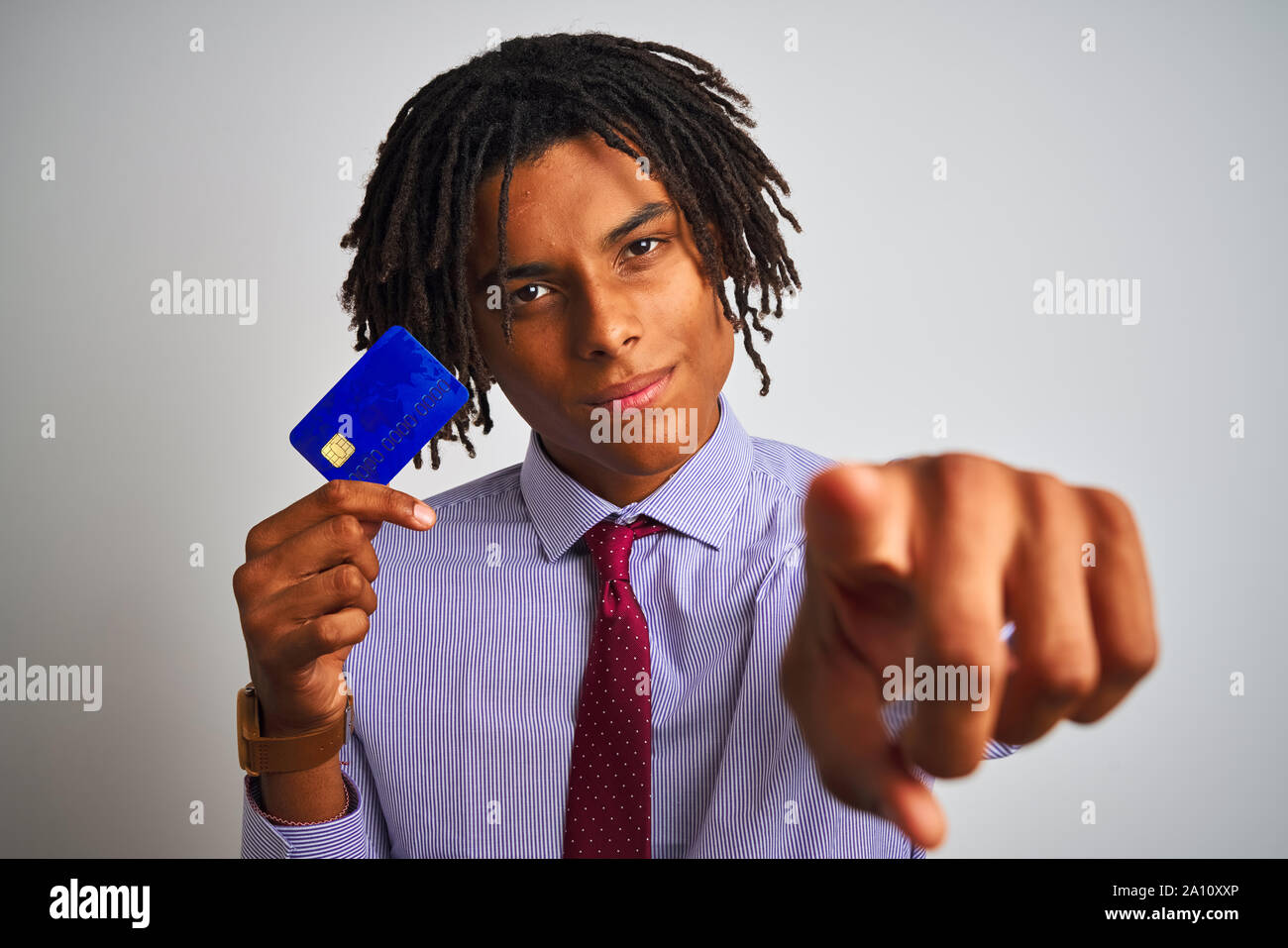 Afro american businessman with dreadlocks holding credit card over ...
