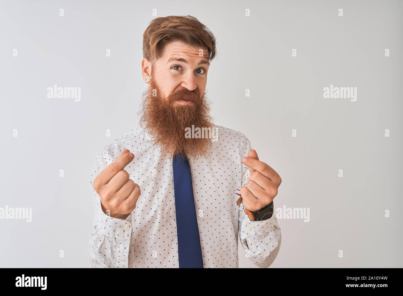 Young redhead irish businessman standing over isolated white background ...
