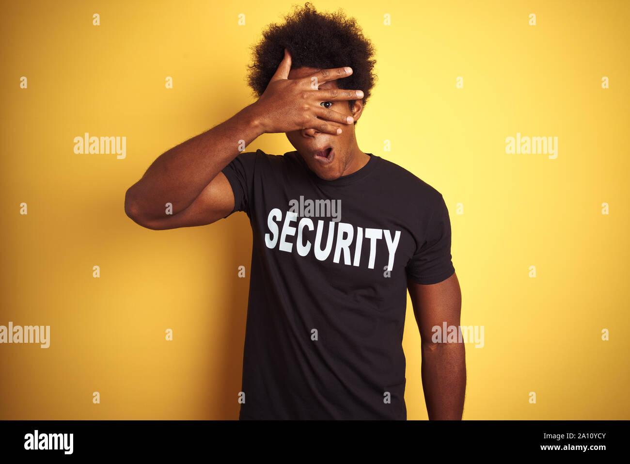 American safeguard man with afro hair wearing security uniform over ...