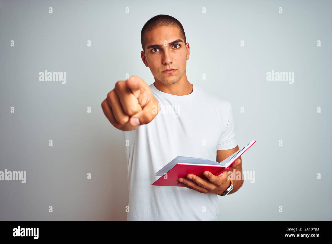 Male teacher pointing book guiding hi-res stock photography and images ...