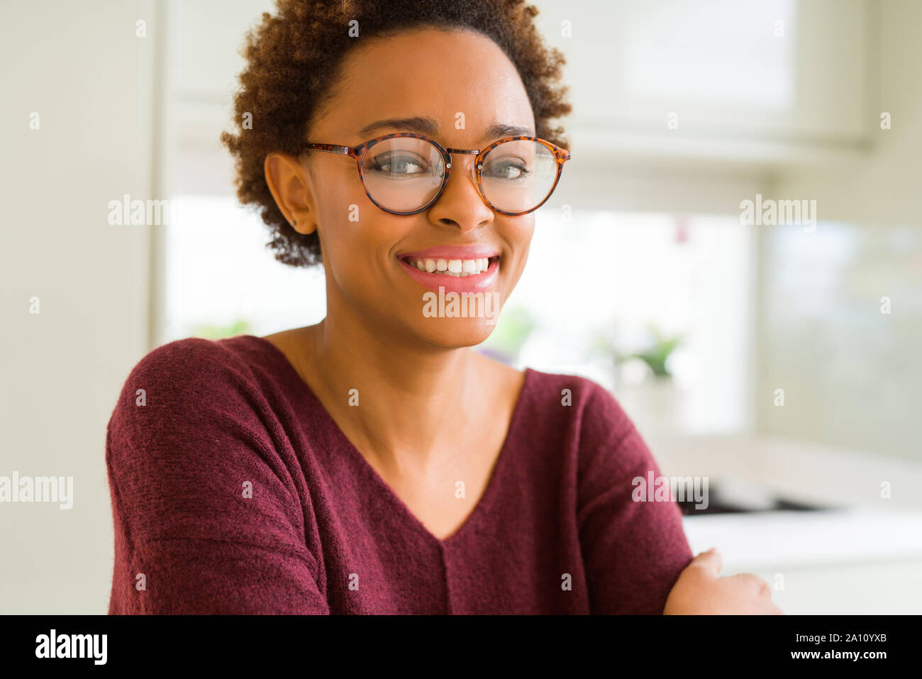 Beautiful young african woman with afro hair wearing glasses Stock ...