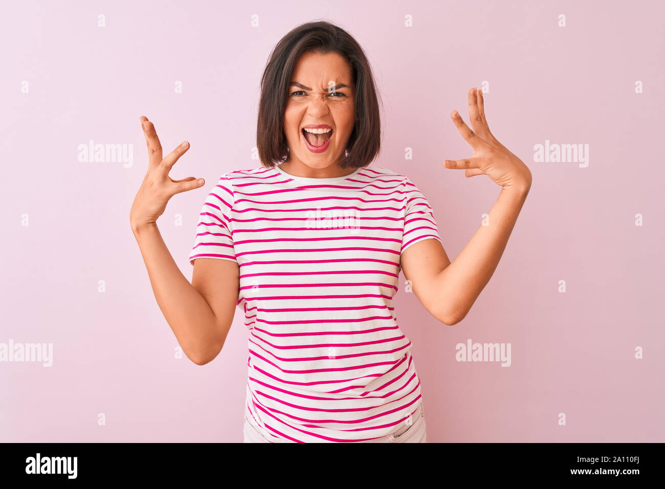 Young Beautiful Woman Wearing Striped T Shirt Standing Over Isolated