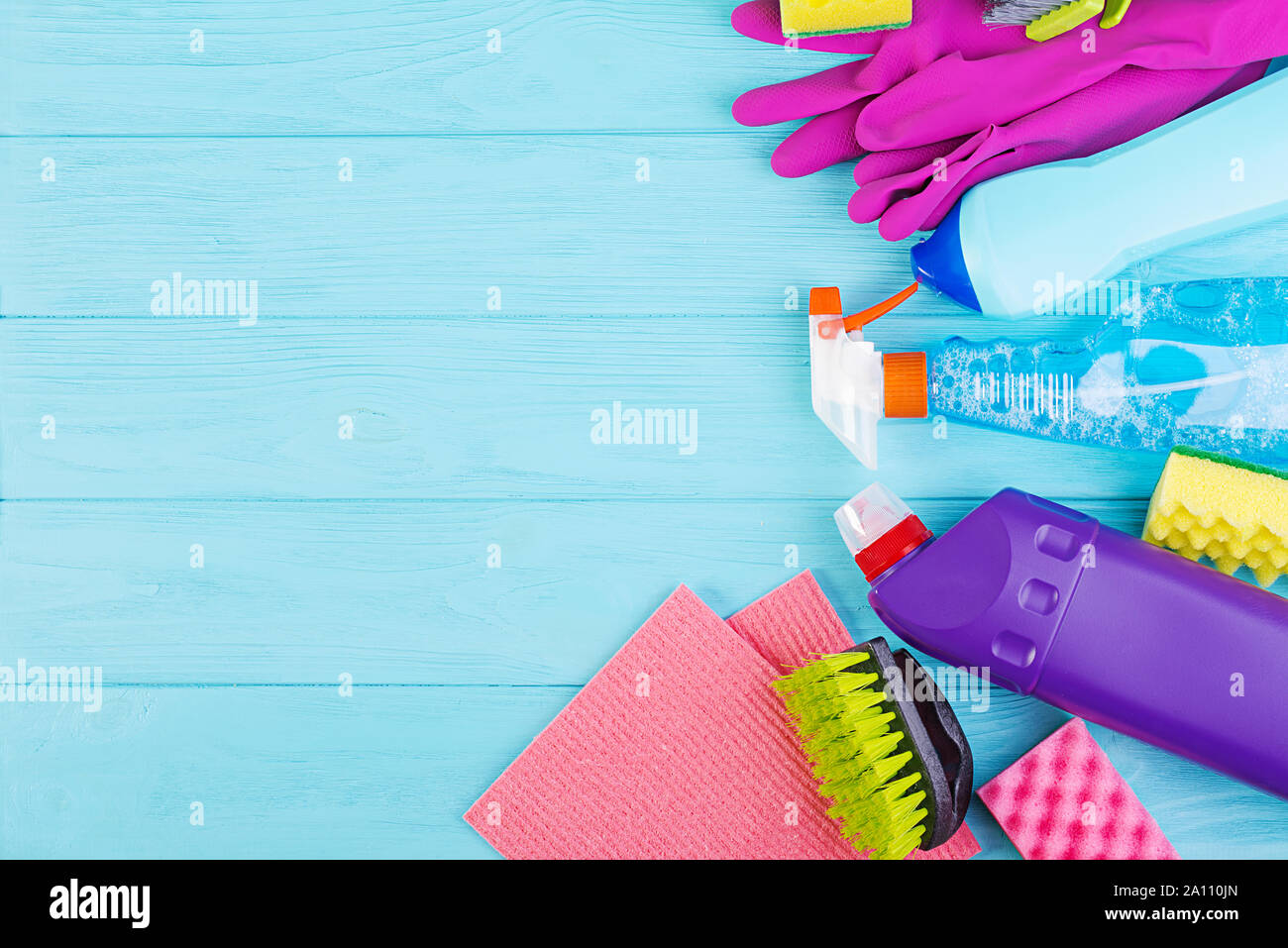 Cleaning service concept. Colorful cleaning set for different surfaces ...