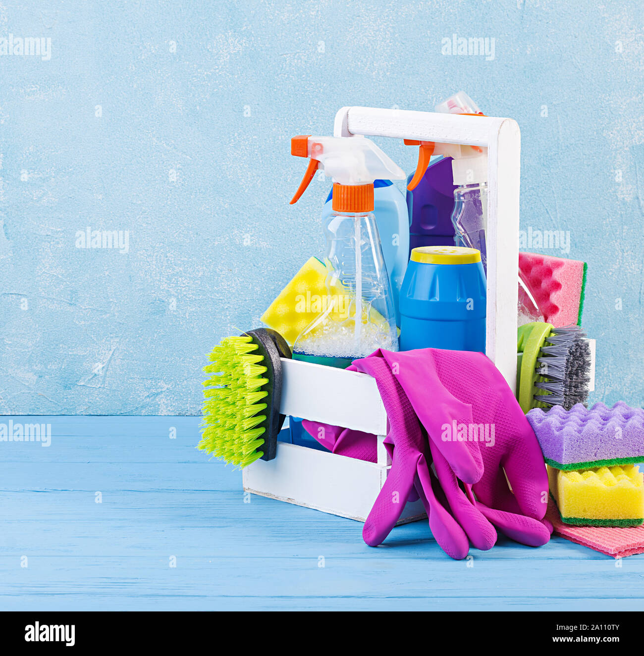 Cleaning service concept. Colorful cleaning set for different surfaces ...