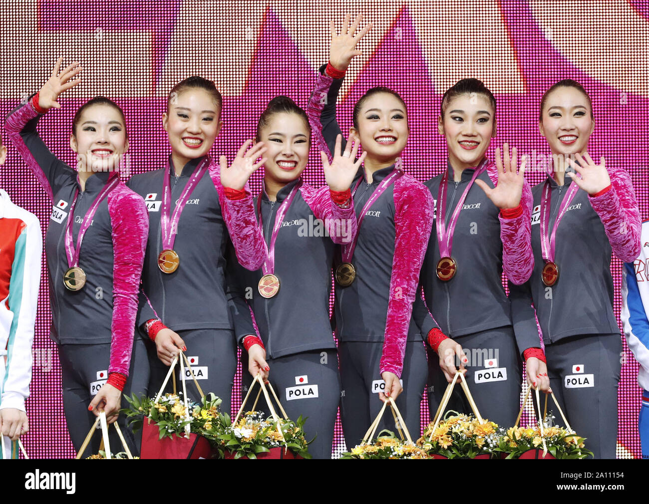 Members of the Japan women's rhythmic gymnastics team -- (from L) Kiko Yokota, Sakura Noshitani ...