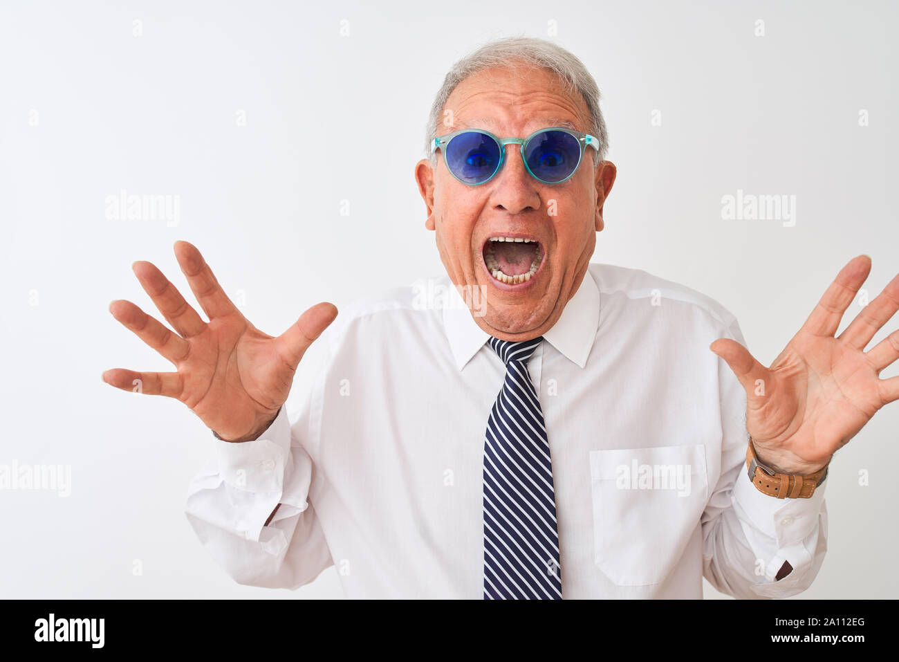 Senior grey-haired businessman wearing tie and sunglasses over isolated ...