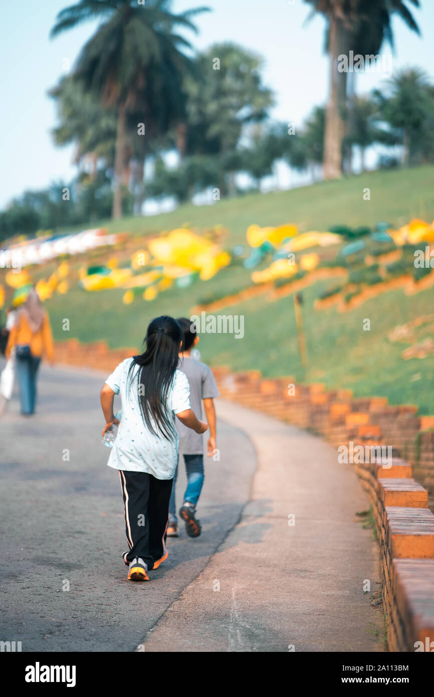 Asian people walking hi-res stock photography and images - Alamy