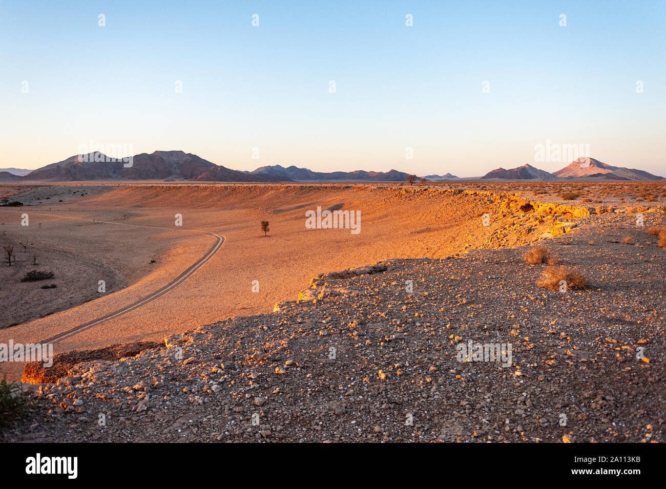 The rising sun is casting long shadows across the Dune Landscape of the ...
