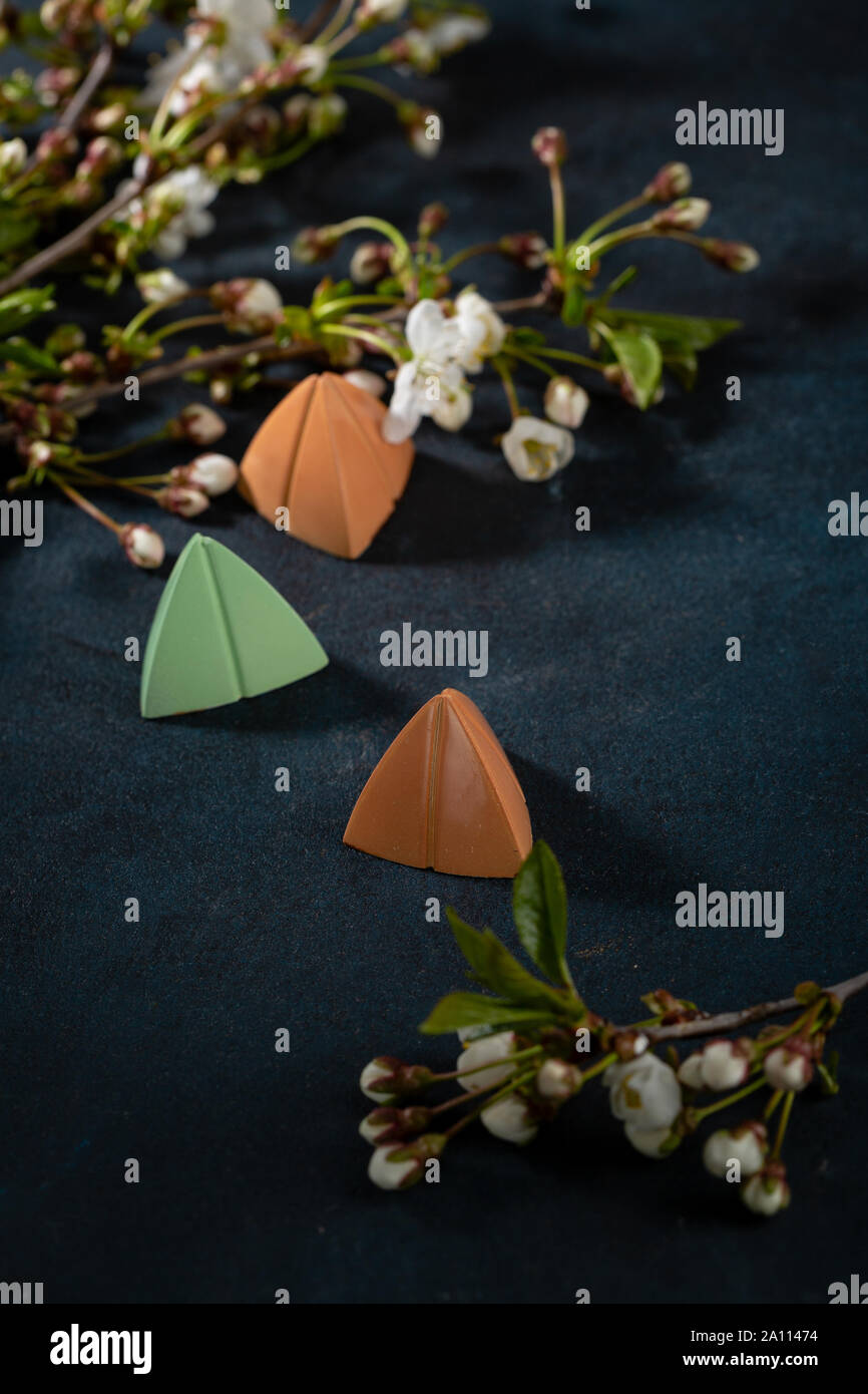 Exclusive chocolate bonbons and cherry twigs Stock Photo - Alamy