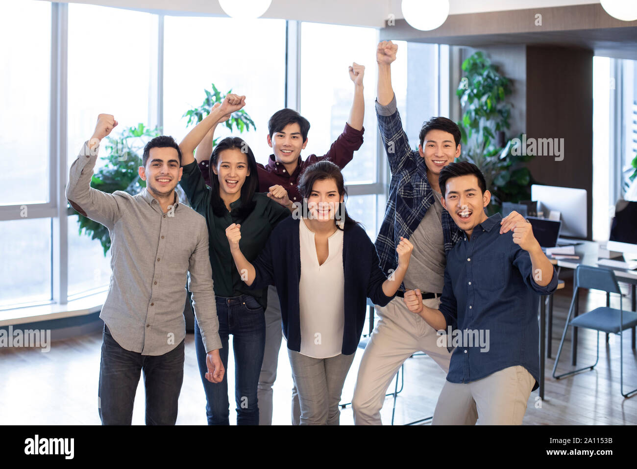Students cheering in classroom hi-res stock photography and images - Alamy