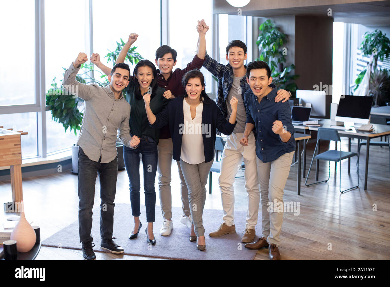 Students cheering in classroom hi-res stock photography and images - Alamy