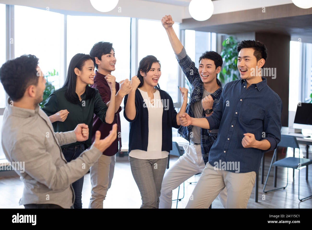Students cheering in classroom hi-res stock photography and images - Alamy