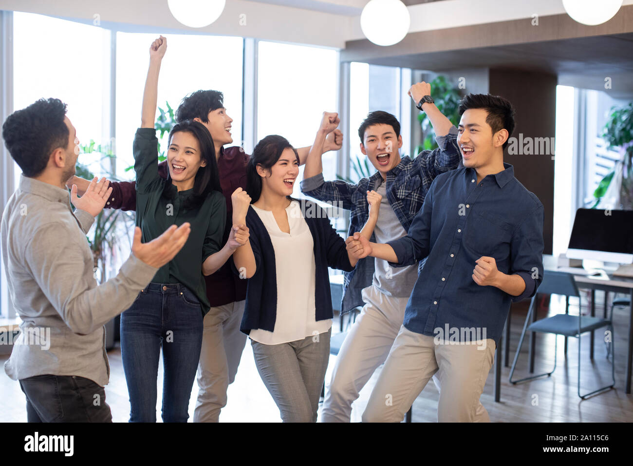 Students cheering in classroom hi-res stock photography and images - Alamy