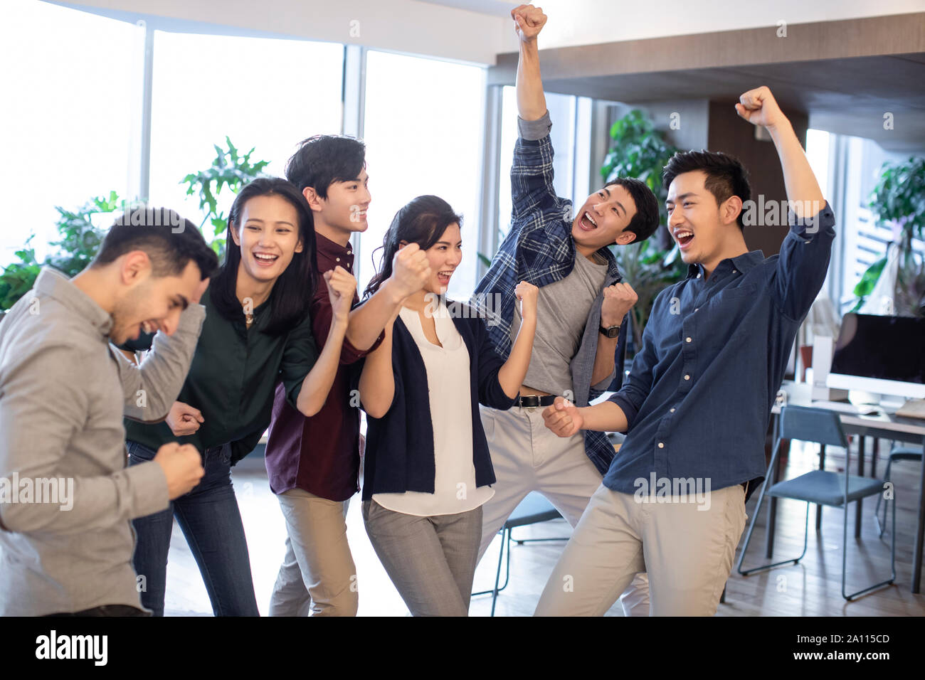 Students cheering in classroom hi-res stock photography and images - Alamy