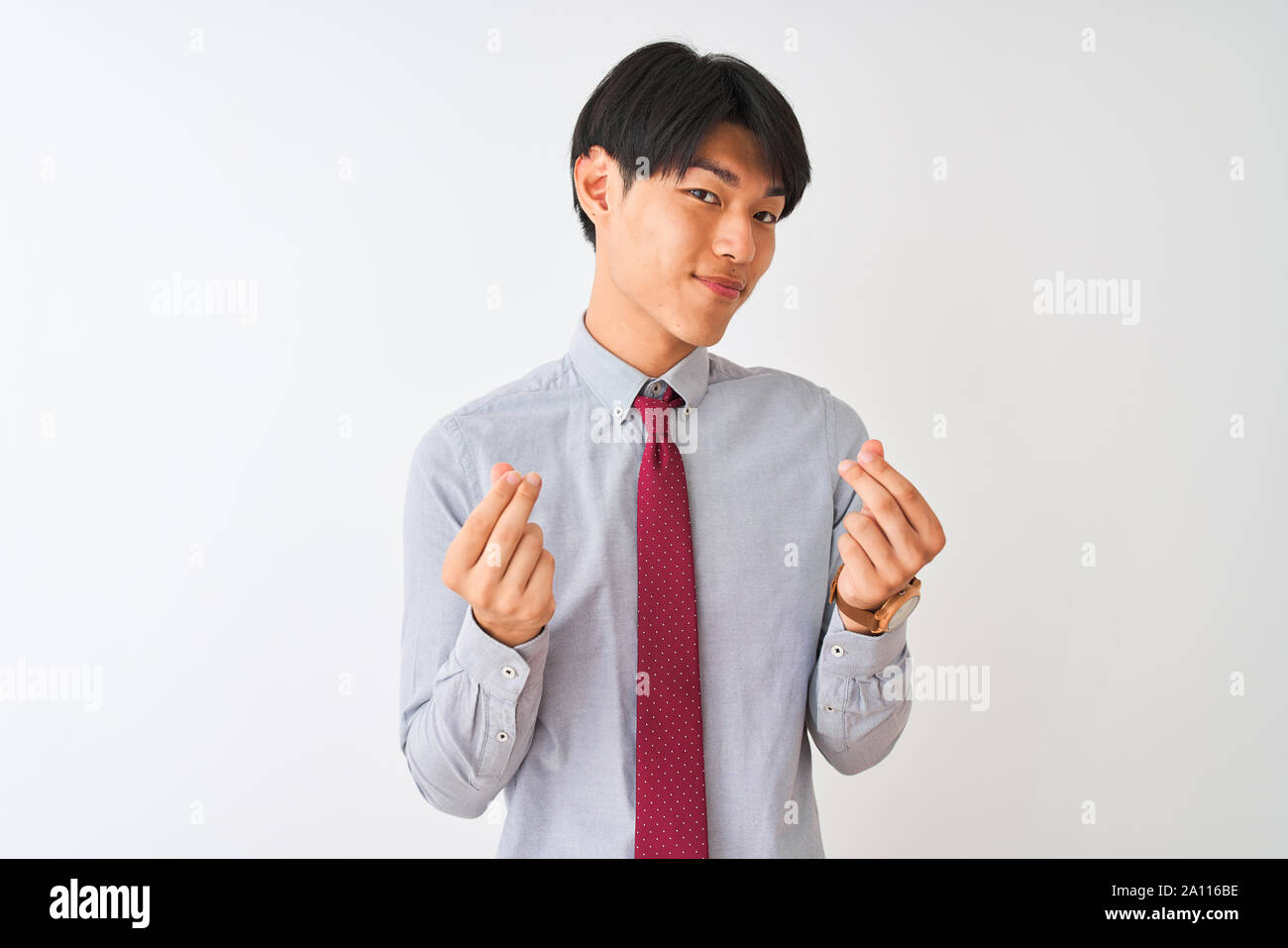 Chinese businessman wearing elegant tie standing over isolated white ...