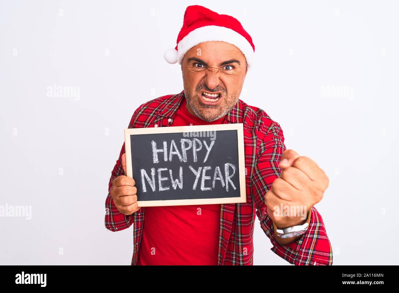 Man wearing Christmas Santa hat holding blackboard over isolated white ...
