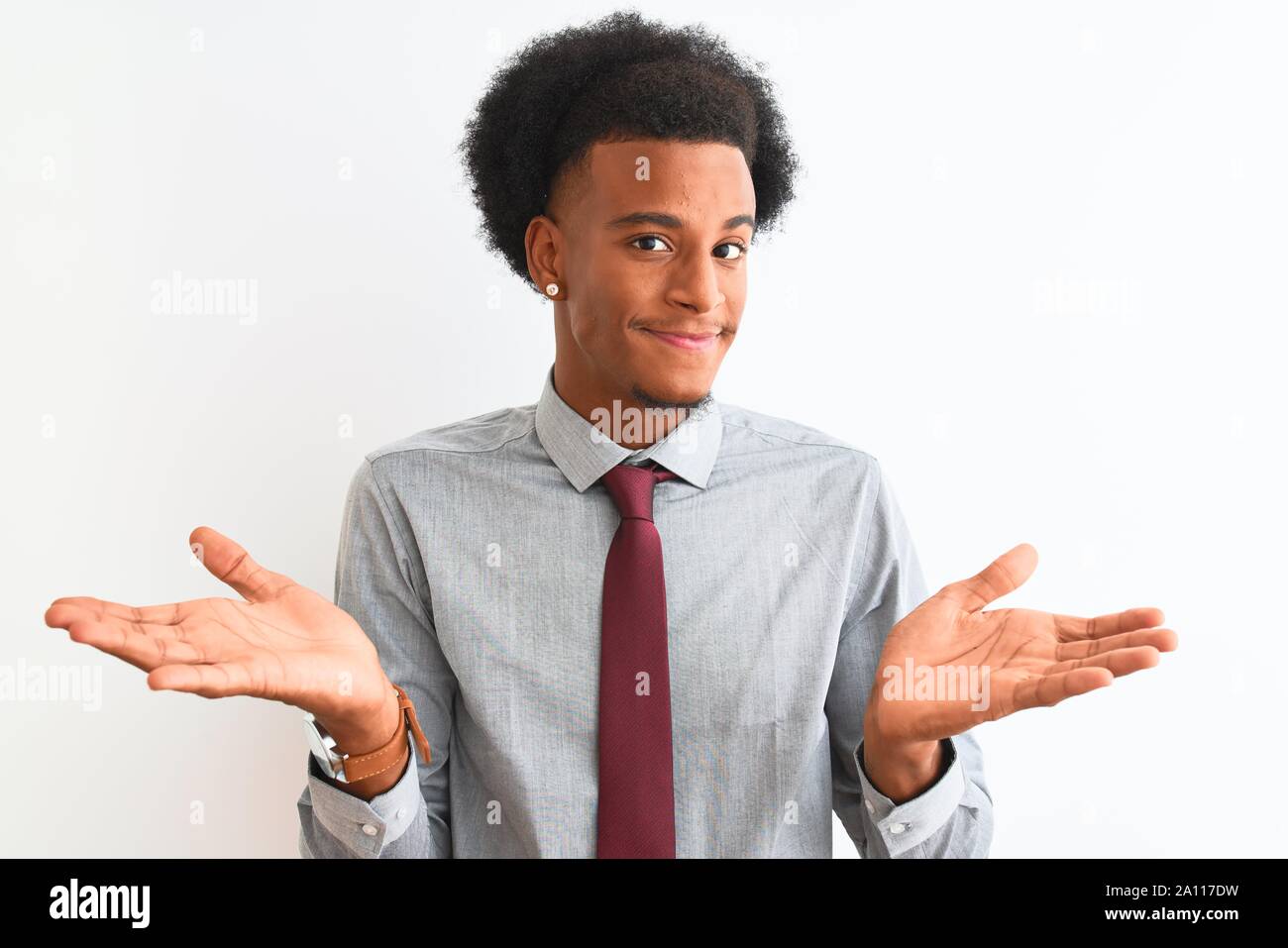 Young african american businessman wearing tie standing over isolated ...