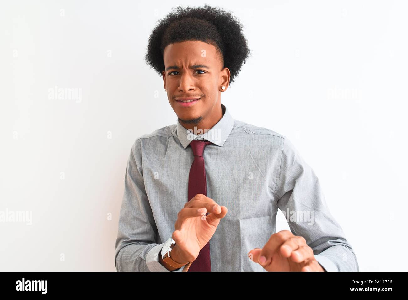Young african american businessman wearing tie standing over isolated ...