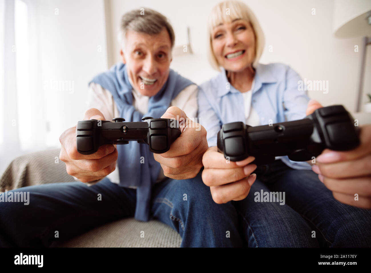 Senior woman playing video games hi-res stock photography and images ...