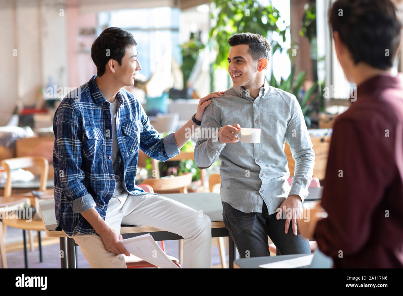 Cheerful abroad students talking in classroom Stock Photo - Alamy