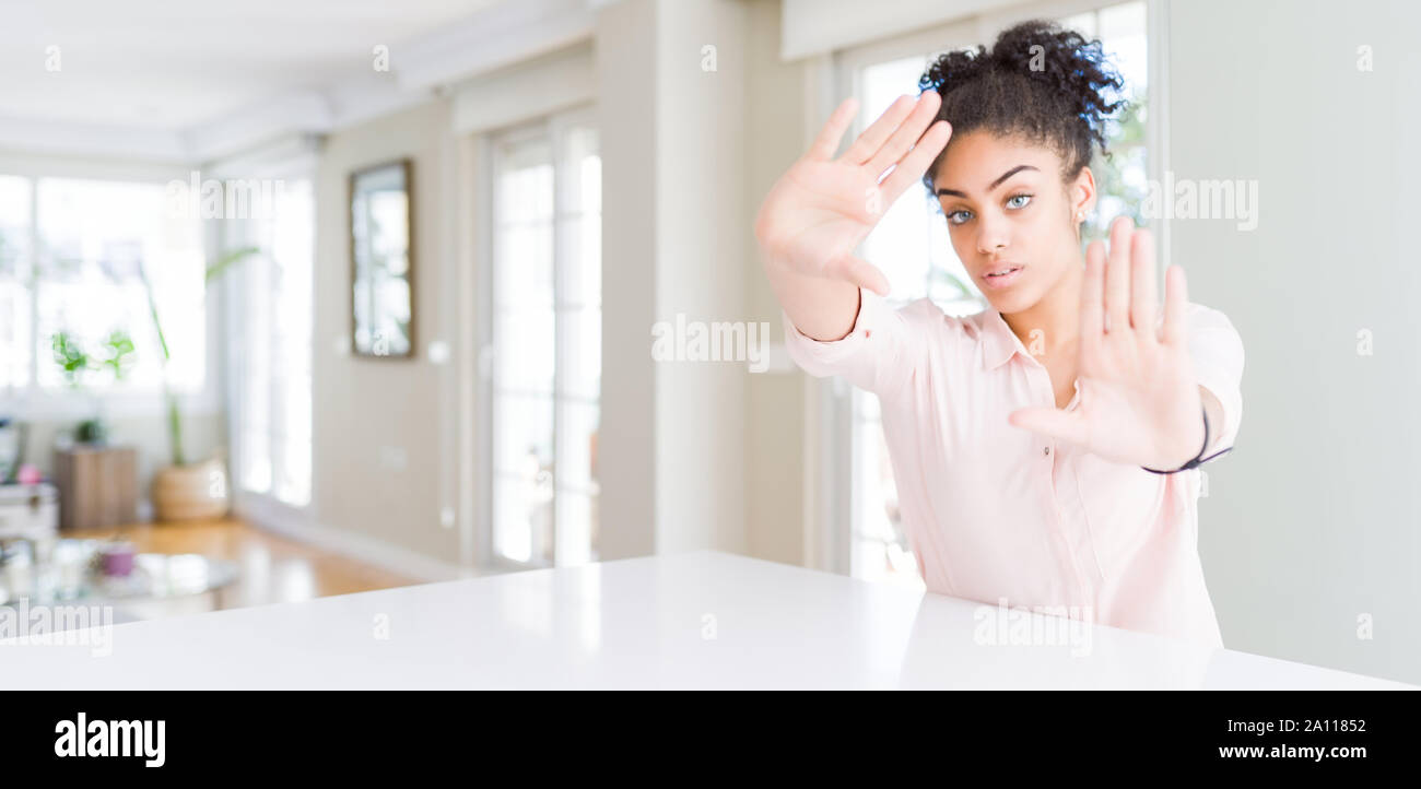 Wide angle of beautiful african american woman with afro hair doing ...