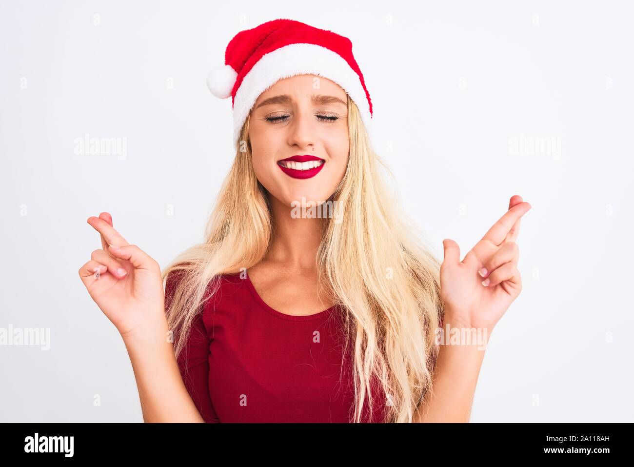 Young Beautiful Woman Wearing Christmas Santa Hat Over Isolated White