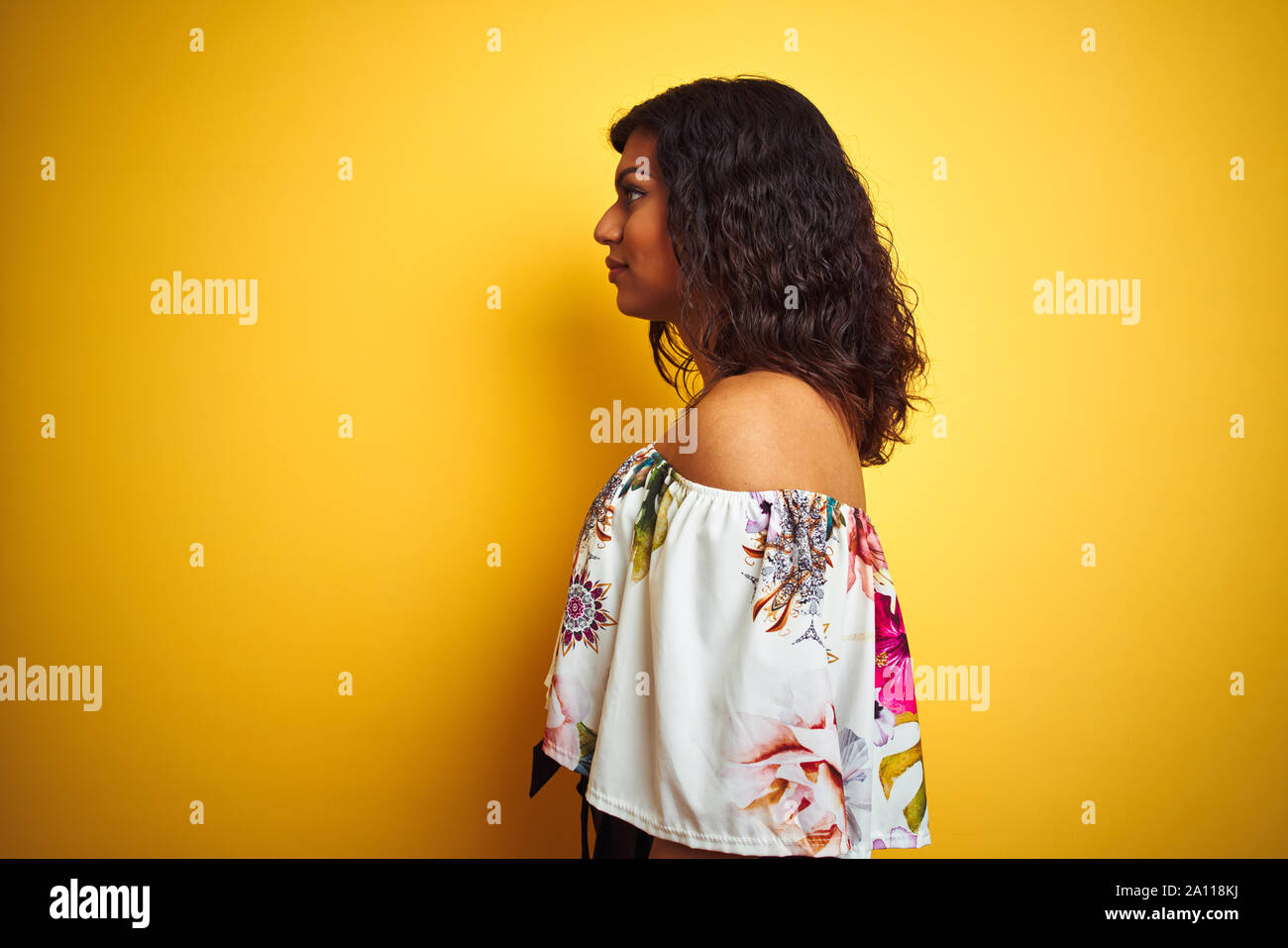 Transsexual transgender woman wearing summer t-shirt over isolated ...