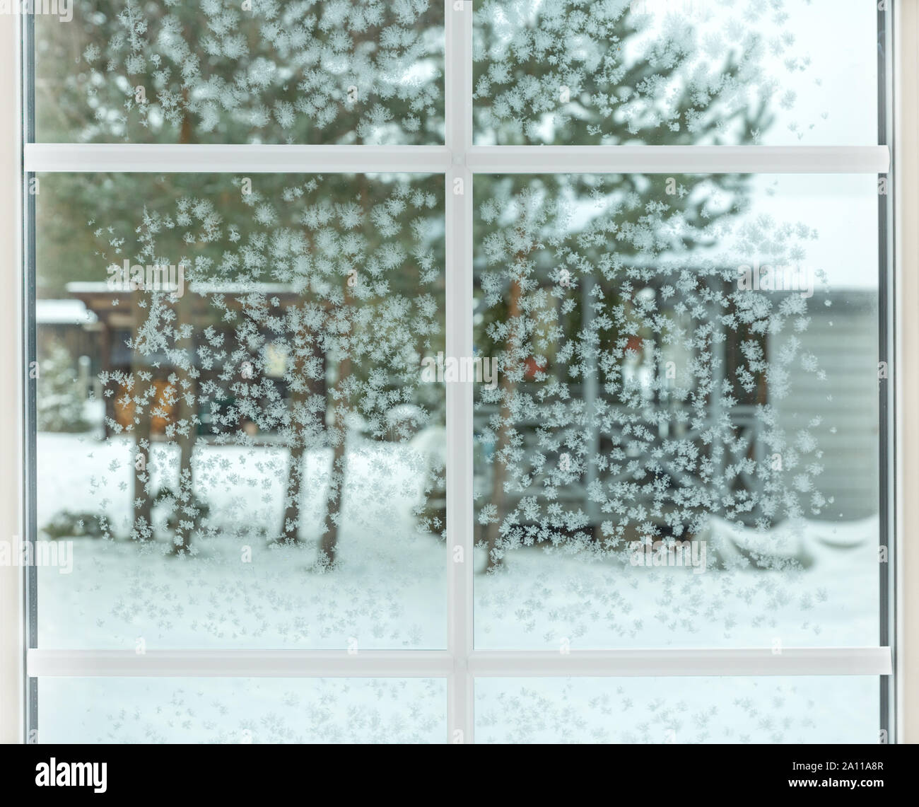 Winter window, drops of water and snowflakes on a window pane Stock ...