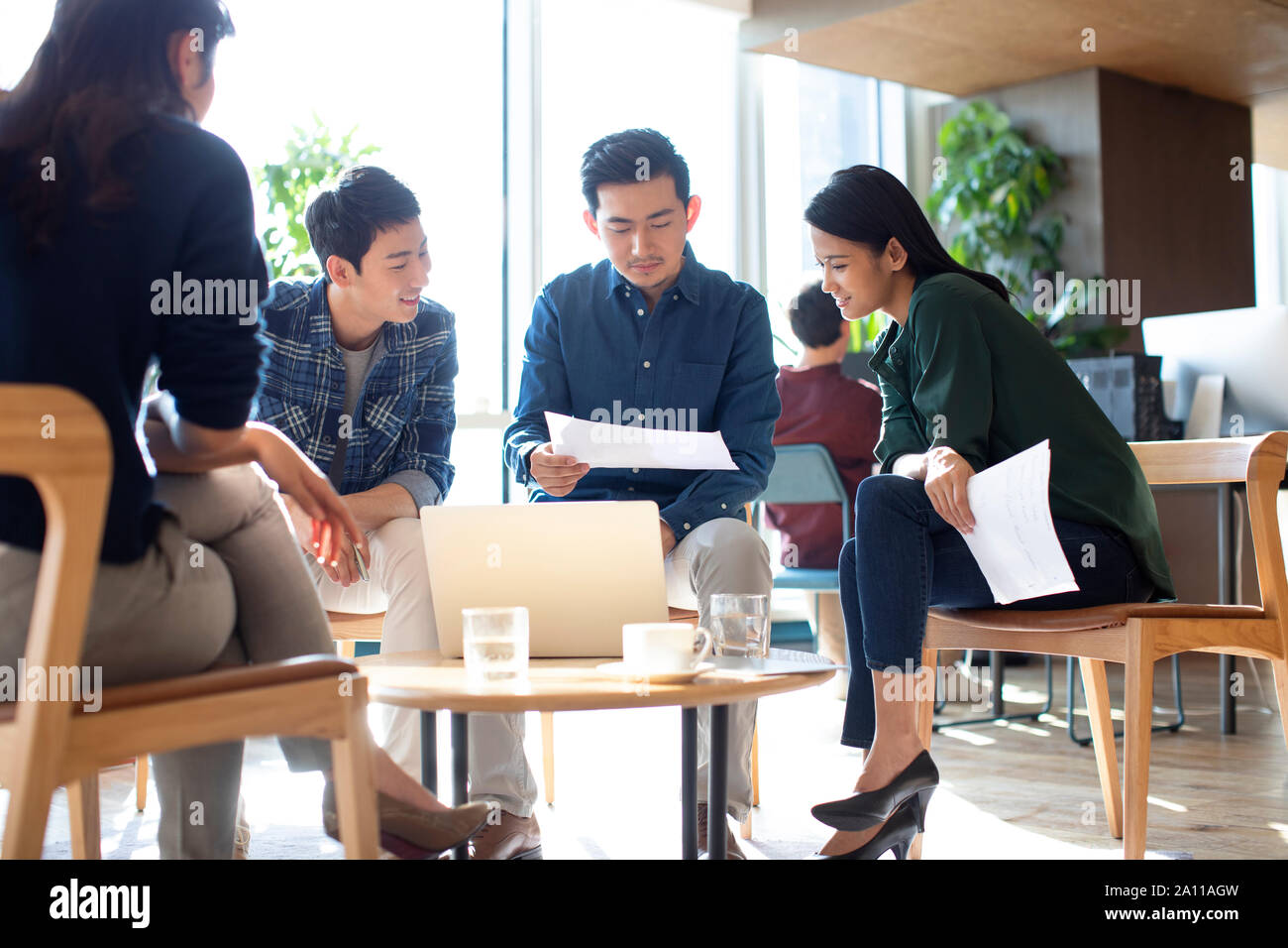 Young college students talking with teacher Stock Photo - Alamy