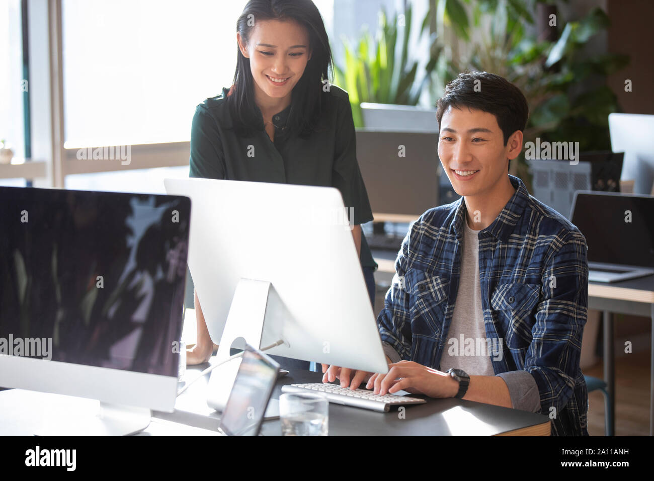 Young college students using computer Stock Photo - Alamy