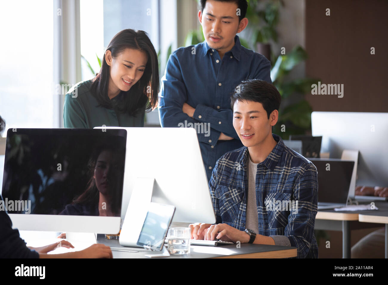 Young college students using computers Stock Photo - Alamy
