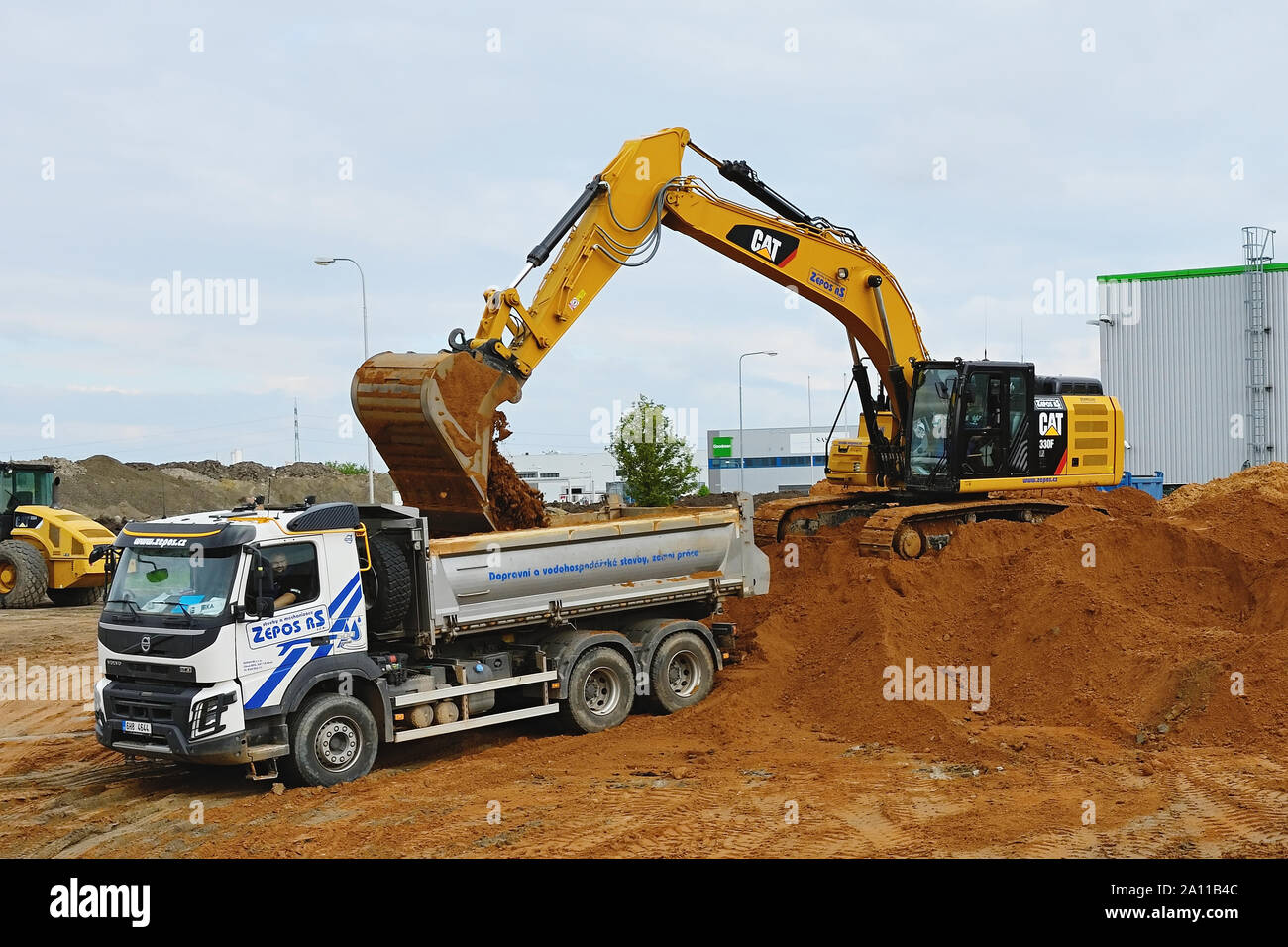 Excavators are digging and loading the excavation to truck in the ...