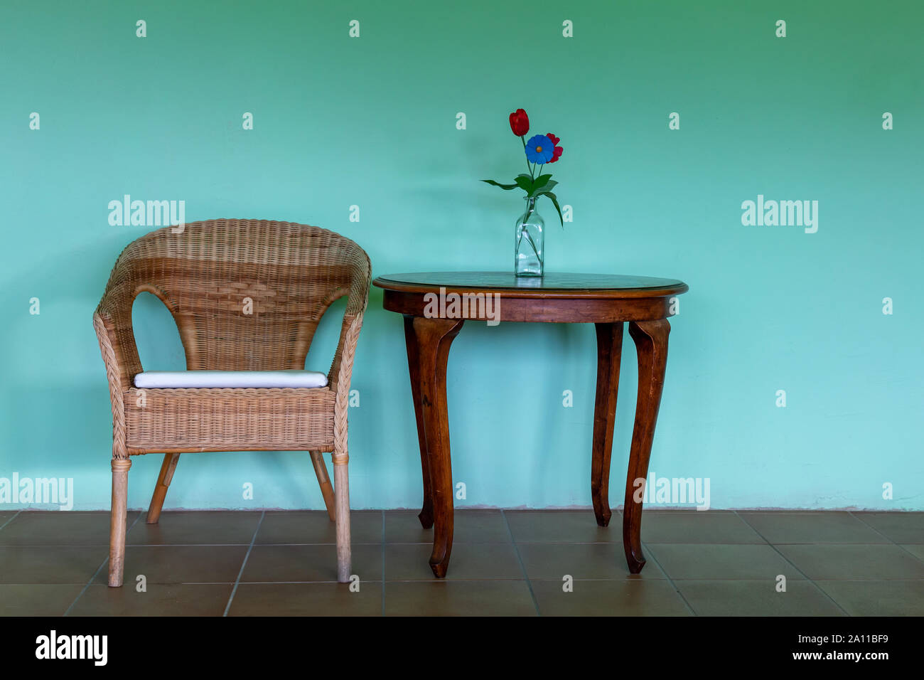 Old style decoration, chair, table and blue wall Stock Photo - Alamy