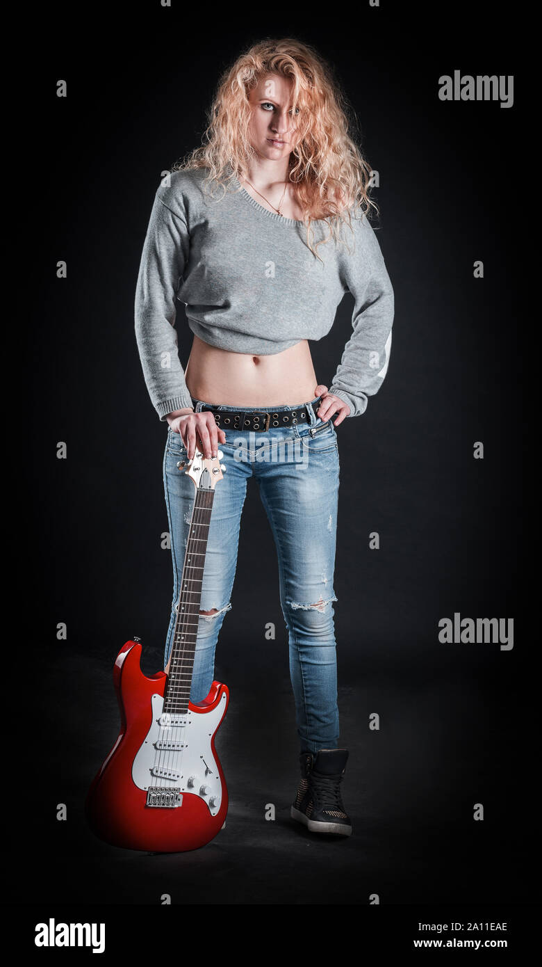 rock singer with guitar standing on stage Stock Photo - Alamy