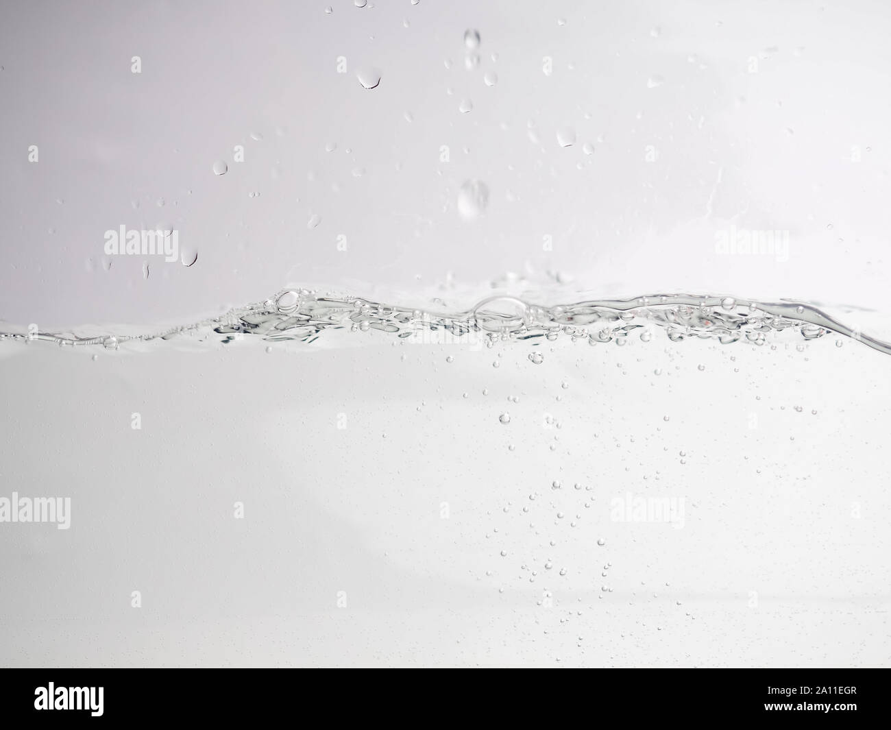 Water Splash or water wave with bubbles of air on the background ...