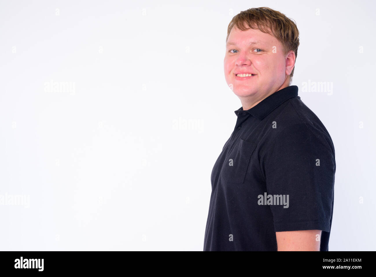 Profile view of happy overweight man looking at camera Stock Photo - Alamy