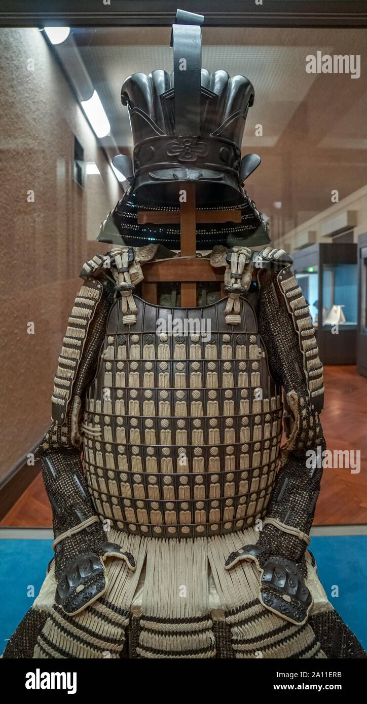 Samurai armor with white lacing and helmet decorated with curls, owned ...