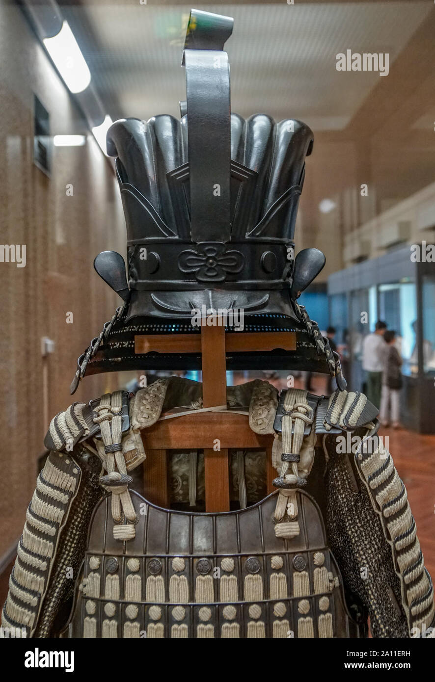 Samurai armor with white lacing and helmet decorated with curls, owned ...