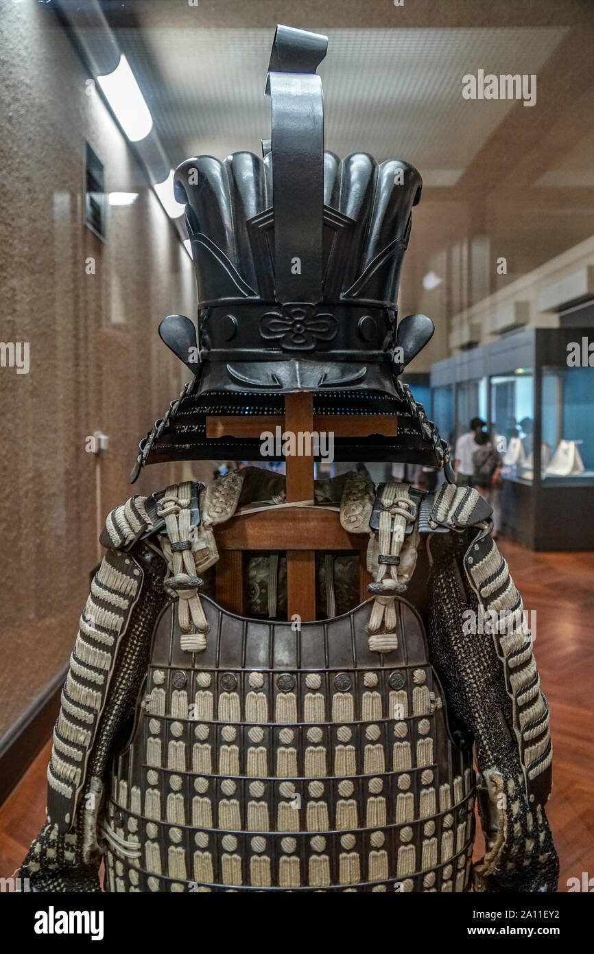 Samurai armor with white lacing and helmet decorated with curls, owned ...