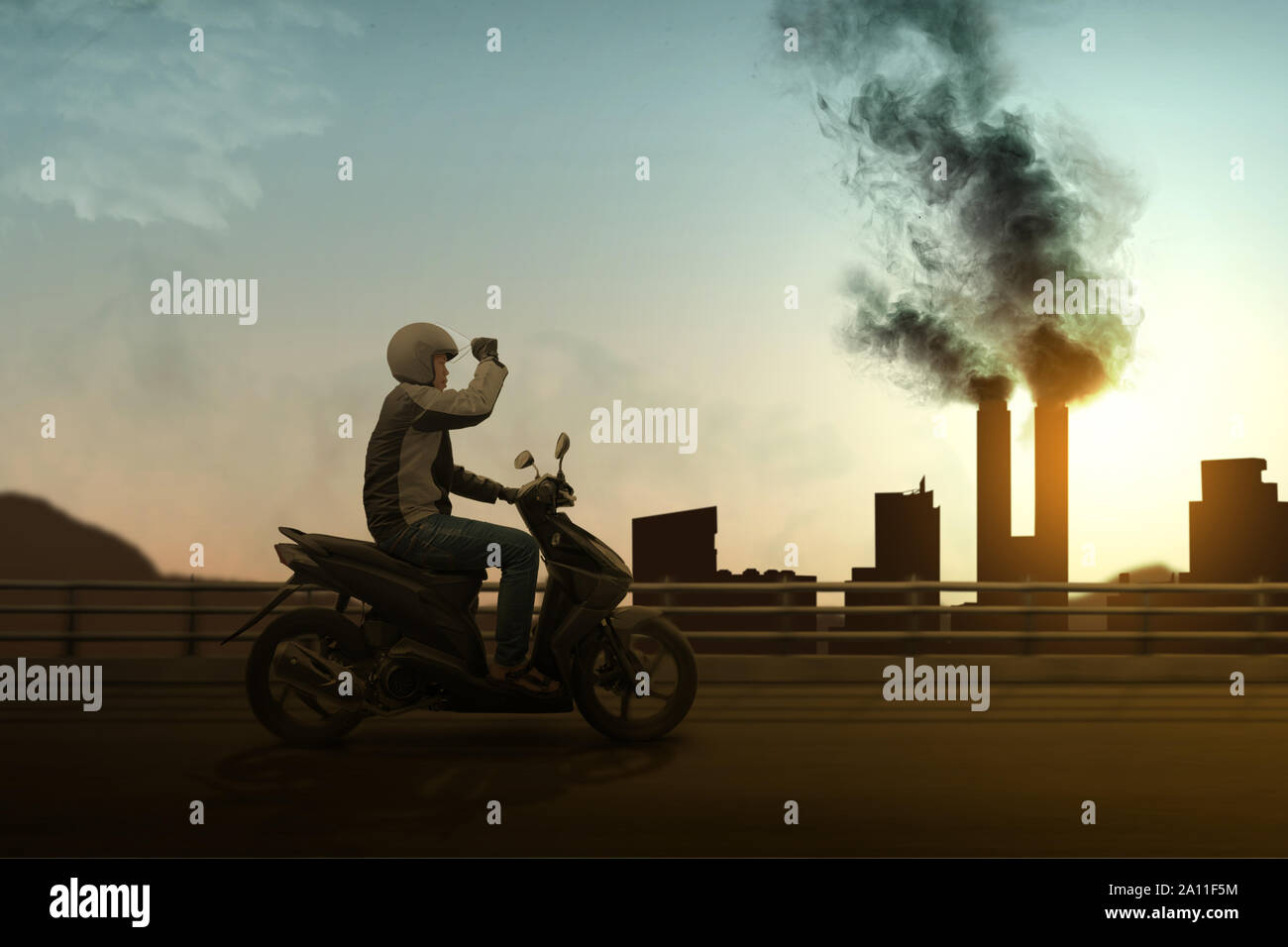 Asian motorcycle taxi man with his motorcycle on the asphalt road with ...