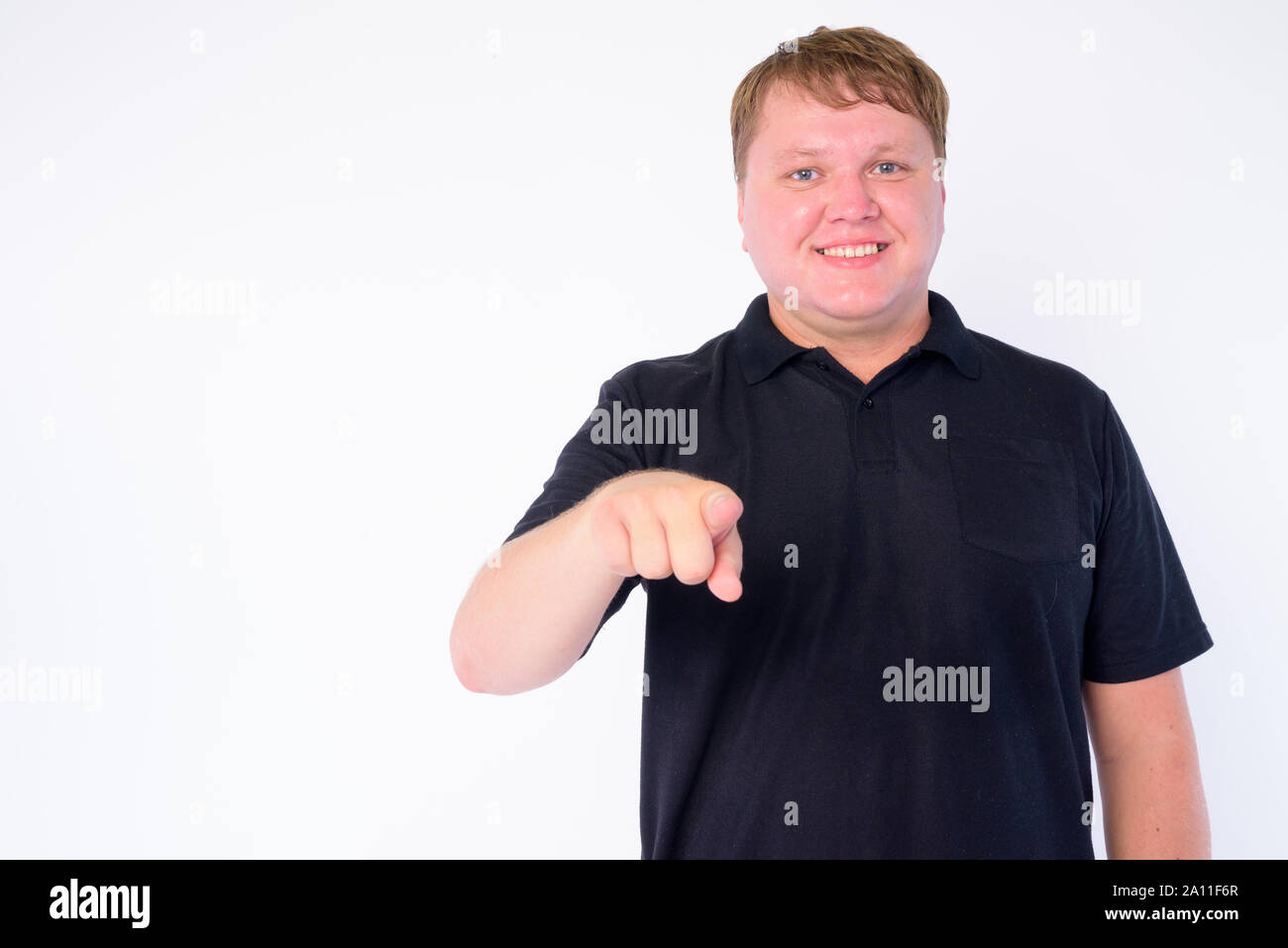 Portrait of happy overweight man pointing at camera Stock Photo - Alamy