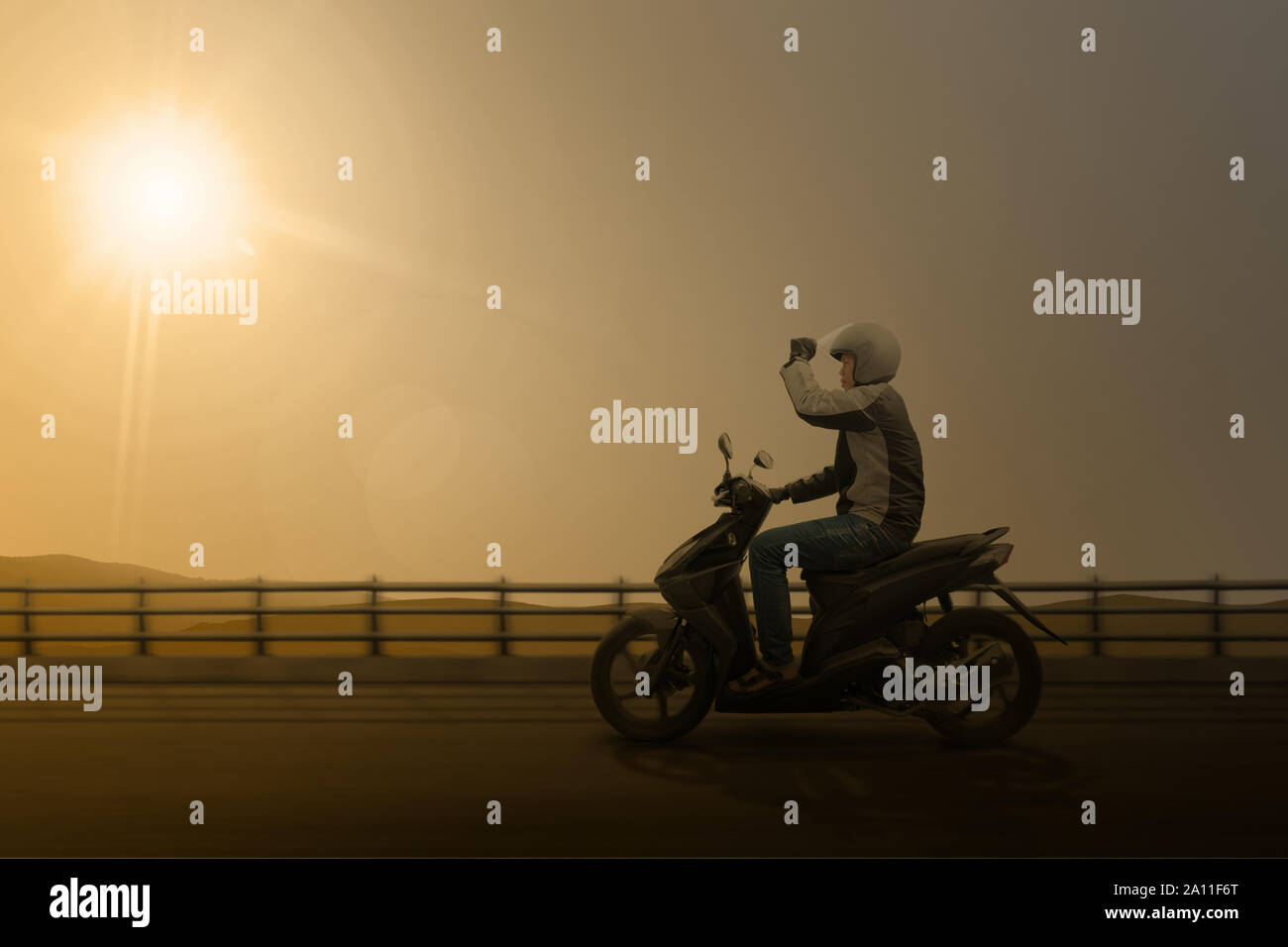 Asian motorcycle taxi man with his motorcycle on the asphalt road Stock ...